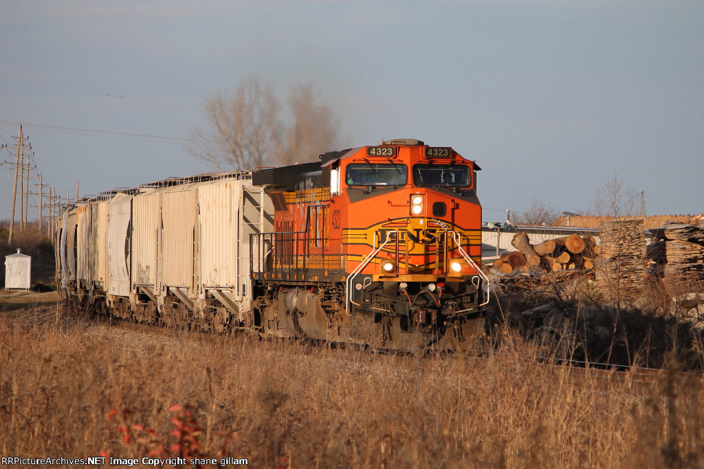 BNSF 4323 is a 1 unit wonder on this long cement train.